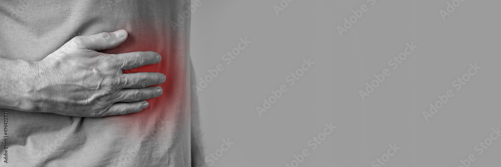 Banner with man suffering from liver pain. Hand holding abdomen right ...