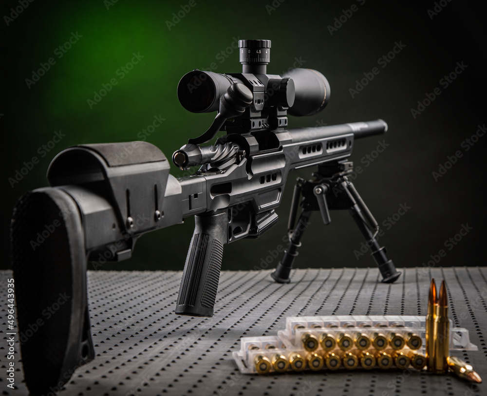 Modern powerful sniper rifle with a telescopic sight mounted on a bipod ...