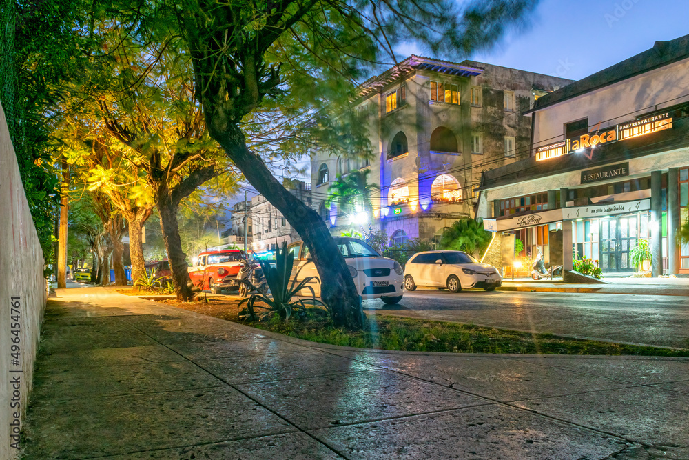HAVANA, CUBA, A city street at night. Long exposure La Roca restaurant ...