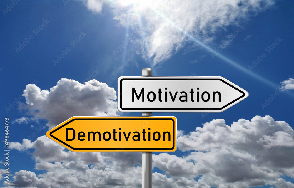 Road sign with two directions motivation and demotivation with blue sky ...