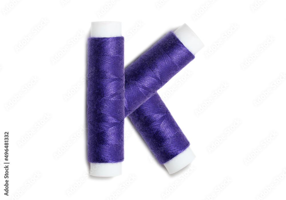 Letter of K from thread spools, isolated on white background. Alphabet ...