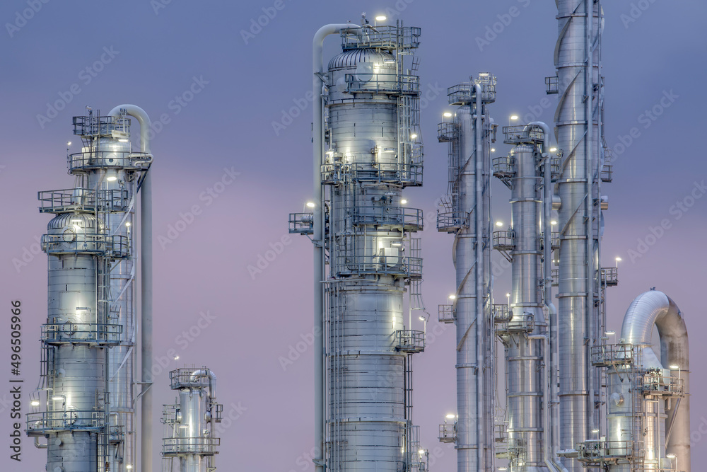 Fractionating towers at a petrochemical plant. Stock Photo | Adobe Stock