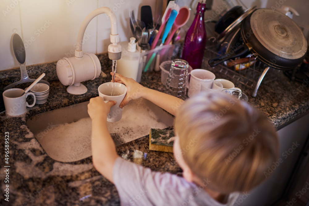 Chores are a vital life skills for kids to learn. High angle shot of a ...