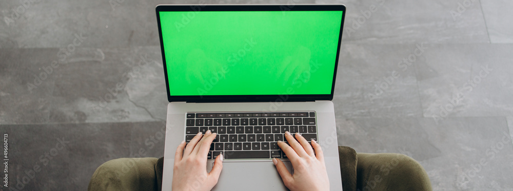 Over The Shoulder View Of Woman Lying On Sofa Using Green Screen Laptop ...