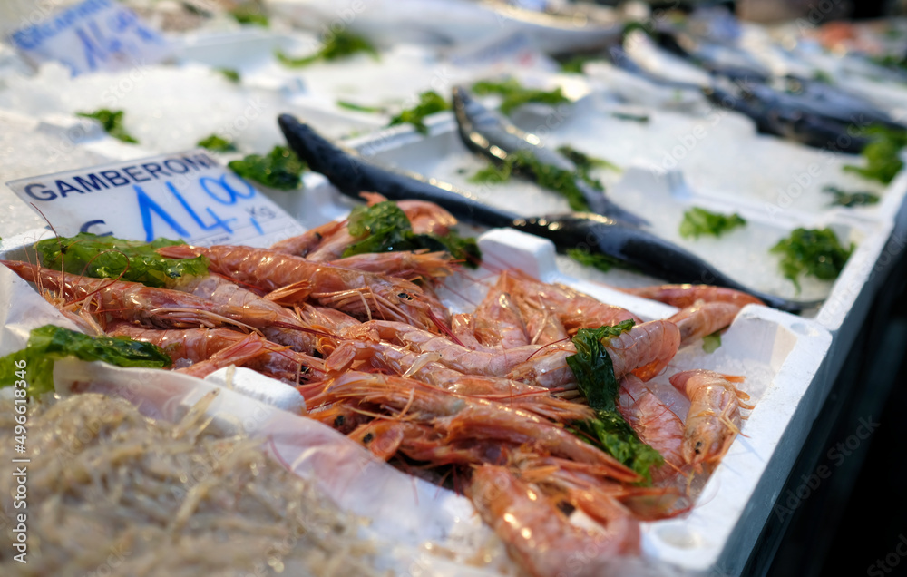 Prawns and other seafood on ice on display at a fish market Stock Photo ...