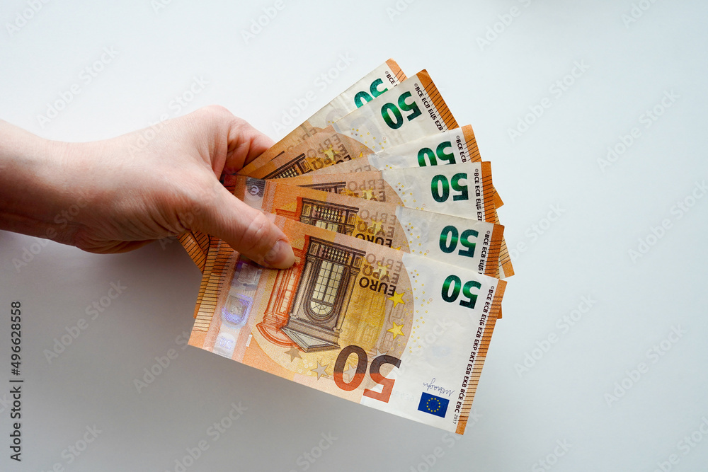 Geldscheine 50 Euro. Hand mit Geldscheine. Stock Photo | Adobe Stock