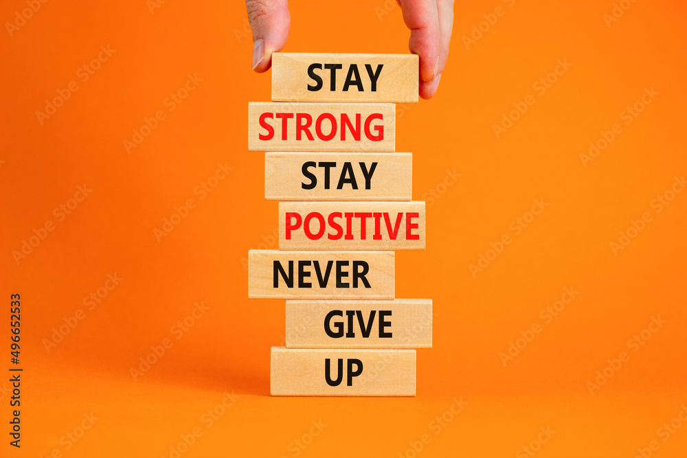 Never give up symbol. Wooden blocks with concept words Stay strong stay ...
