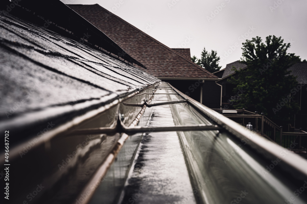 Selective focus on a section of residential guttering with hanger ...