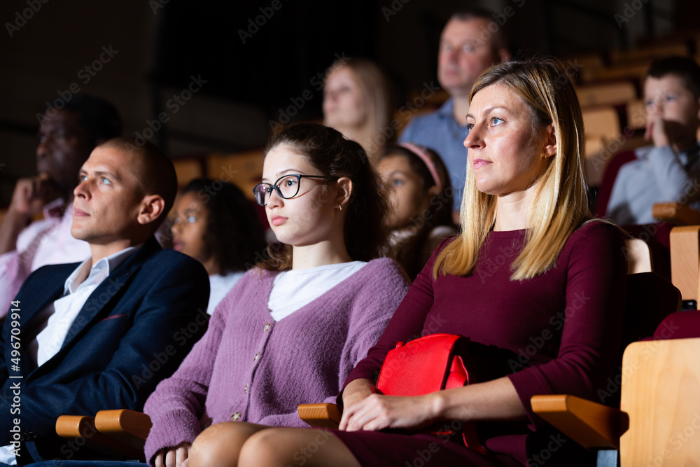 Portrait of family couple visiting theater with their teenage daughter ...