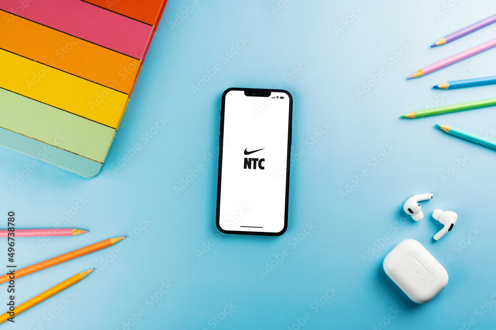 Nike Training Club NTC app on the smartphone screen. Blue background ...