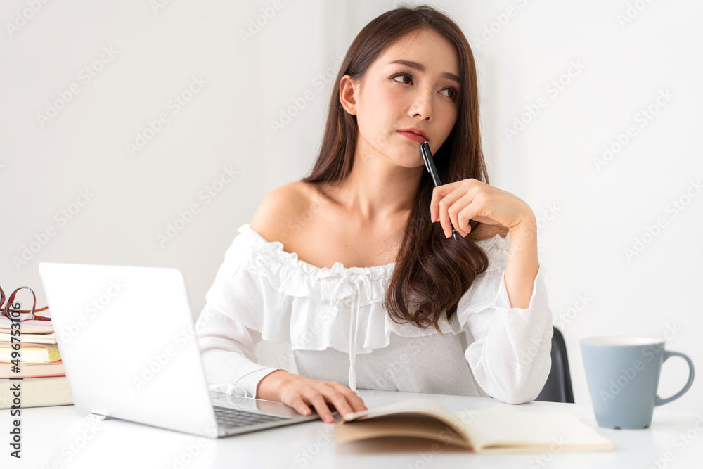 Portrait of smiling happy beautiful asian woman relaxing using ...