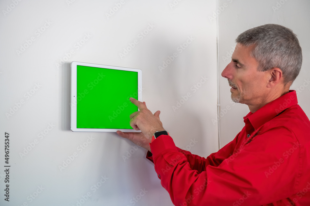 Smart home and technology concept, male hands pointing finger to a ...