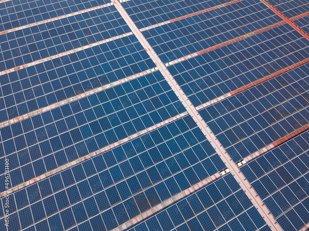 An array of polycrystalline solar panels on the roof of a shopping mall ...
