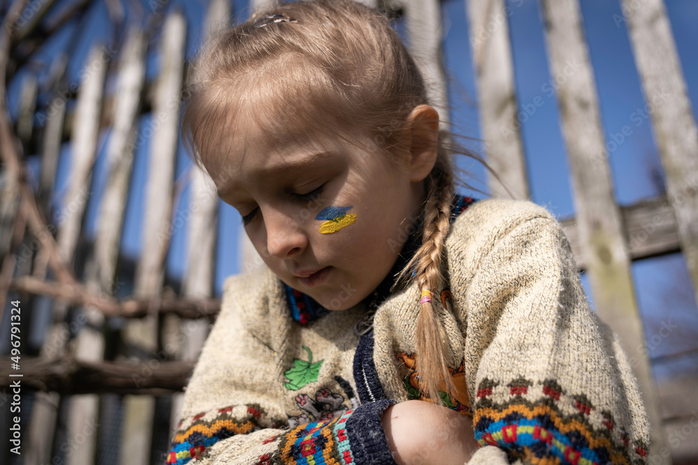 Ukrainian girl is sad because of the war in Ukraine. Anxiety and ...