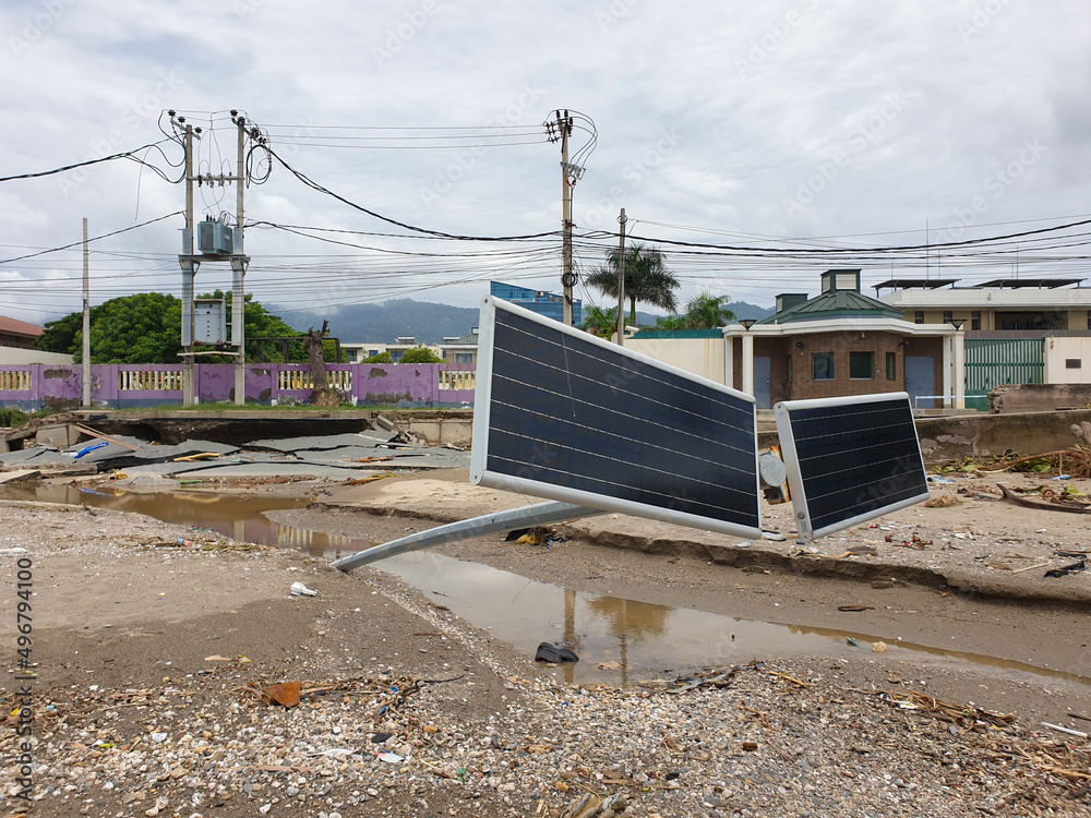 A solar panel collapsed and damaged after flash flooding on the beach ...