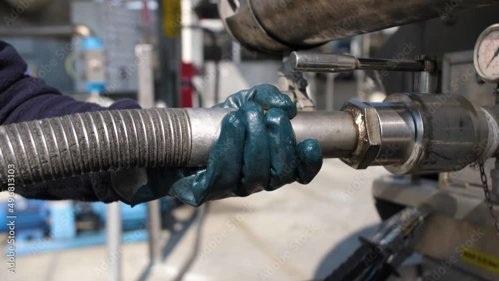 worker connects the pipe, petrol, gas, connection, truckworker connects ...