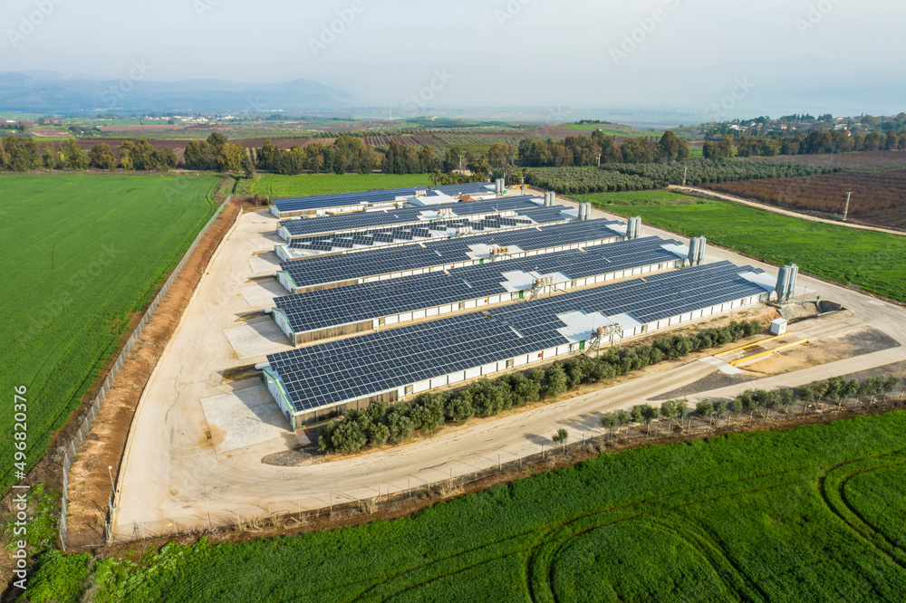 Aerial view of livestock farms covered with solar panels, Galilee ...