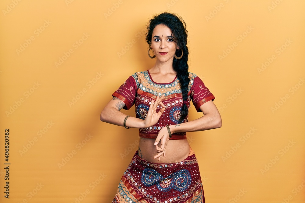 Young indian woman wearing traditional belly dancer costume. Dancing ...