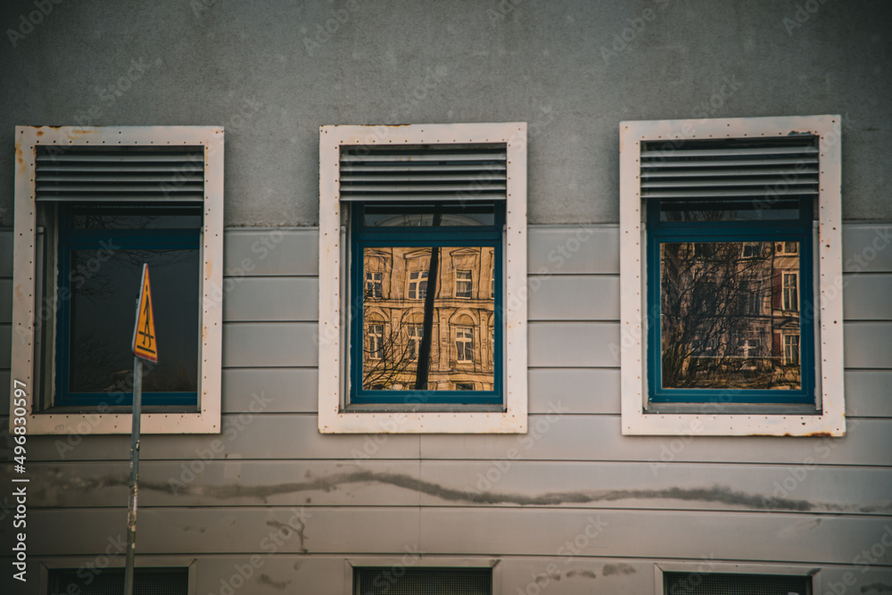 House facade with windows with historic building reflections Stock ...