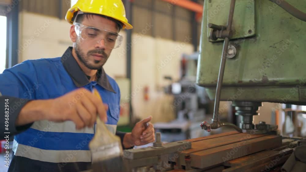 Engineer wearing safety helmet and glasses standing in the production ...