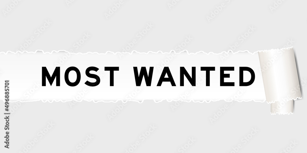 Ripped gray paper background that have word most wanted under torn part ...