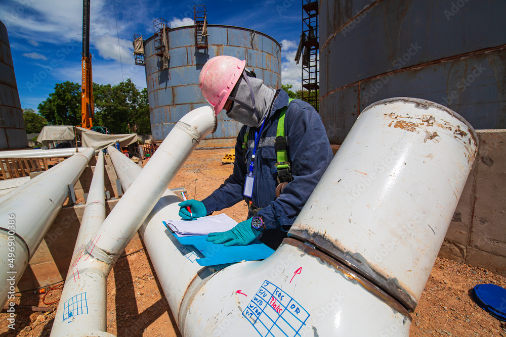 Male worker inspection at steel long pipes and pipe elbow new ...