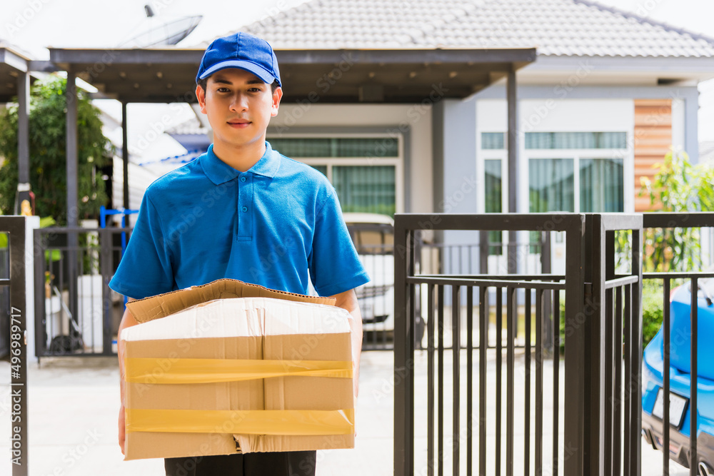 Asian young delivery man in blue uniform he emotional falling courier ...