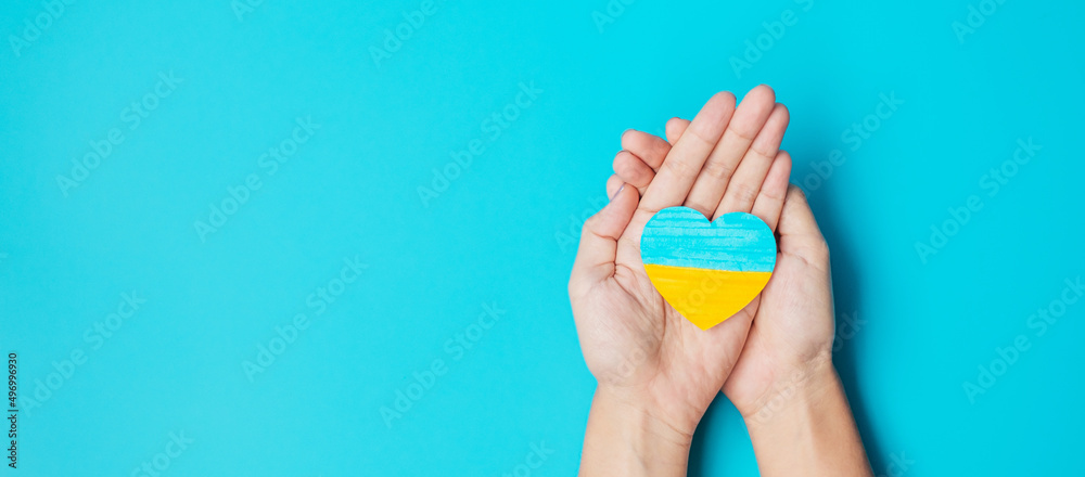 Support for Ukraine in the war with Russia, Hands holding symbol of ...