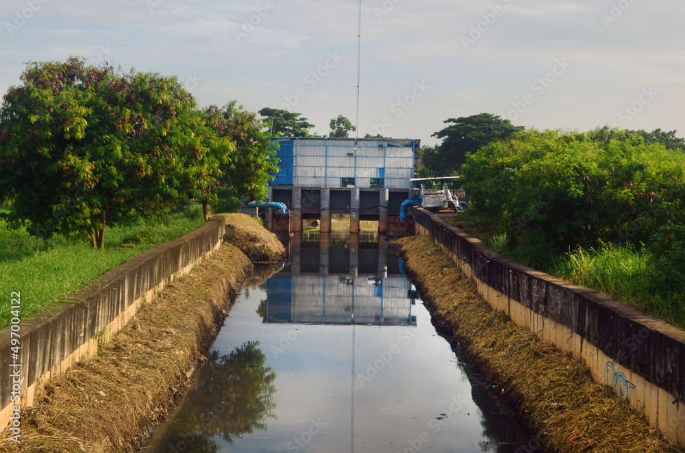 floodgate aqueduct in a concrete wall for irrigation system and flood ...