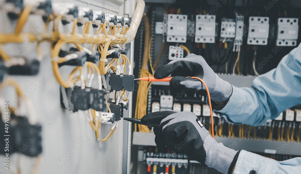 Electrical engineers test electrical installations and wiring on ...