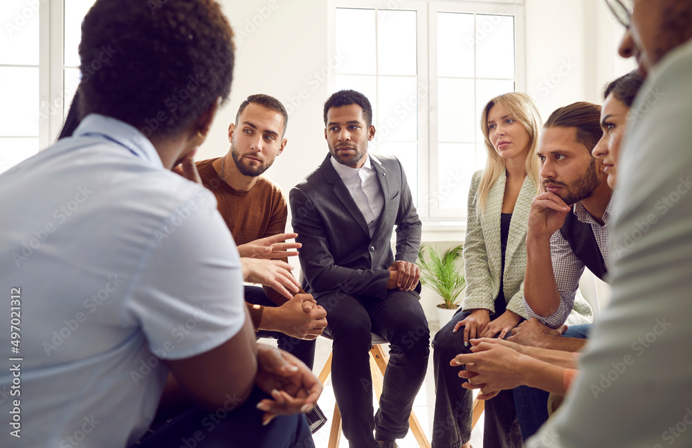 Poster Diverse group of business people talking during meeting in ...