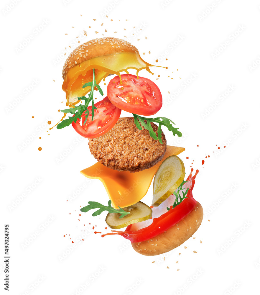 Food ingredients for a traditional burger in the air isolated on a ...