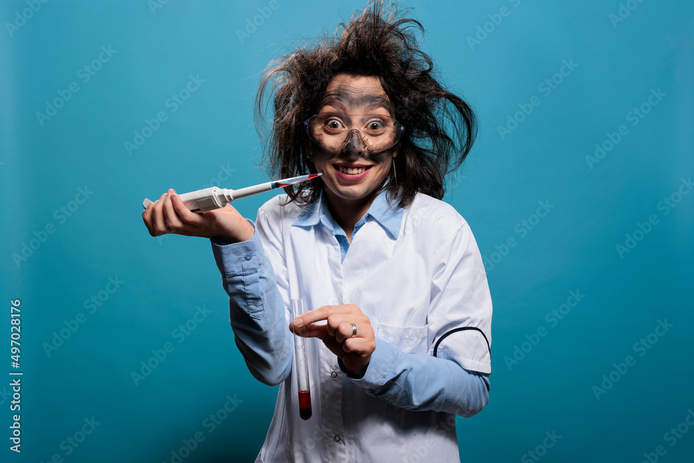 Insane lab worker grinning creepy while dripping toxic compound from ...