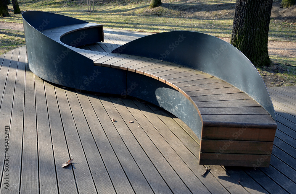 The s-shaped bench resembles a snake and is made entirely of small ...