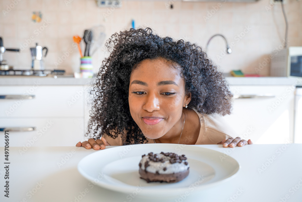 Sad back woman dieting trying to avoid junk food snacking Stock Photo ...