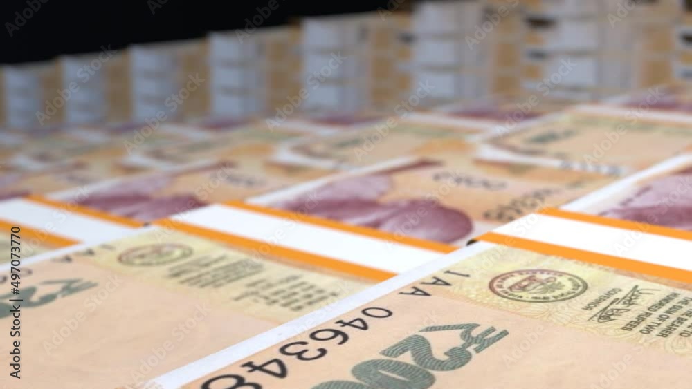 Many wads of money falling down. 200 Indian Rupees banknotes. Stacks of ...