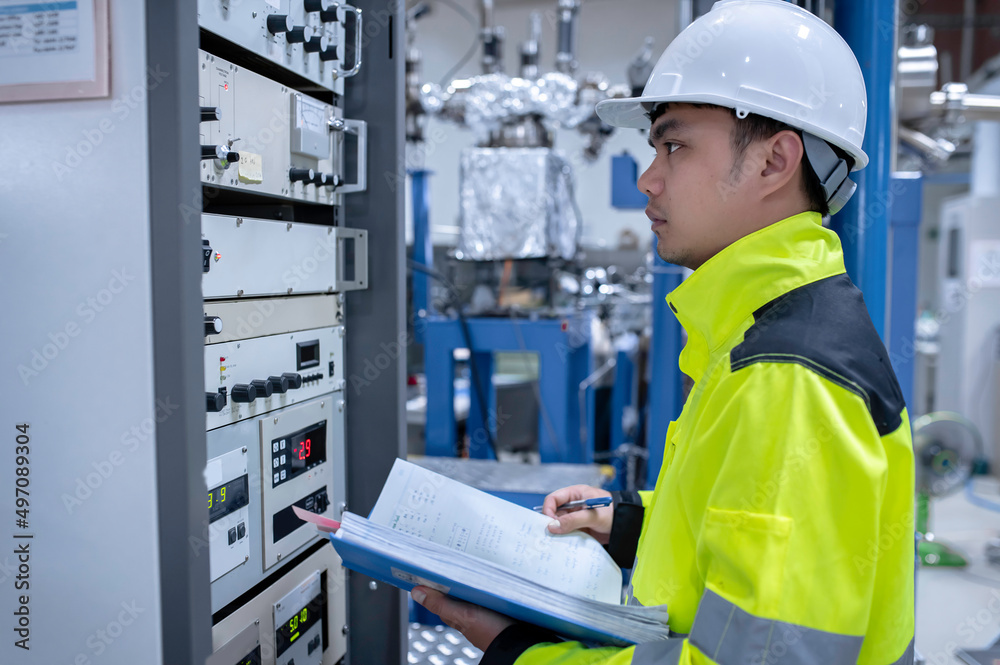 Electrical engineer woman checking voltage at the Power Distribution ...