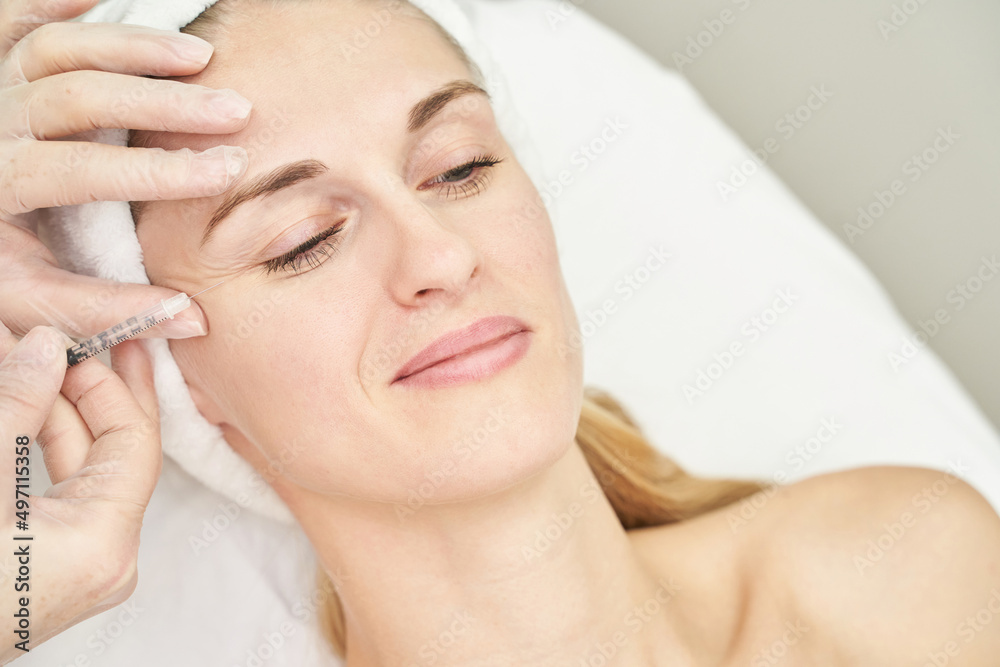 Injection at spa salon. Doctor hands in gloves. Closeup. Pretty female ...