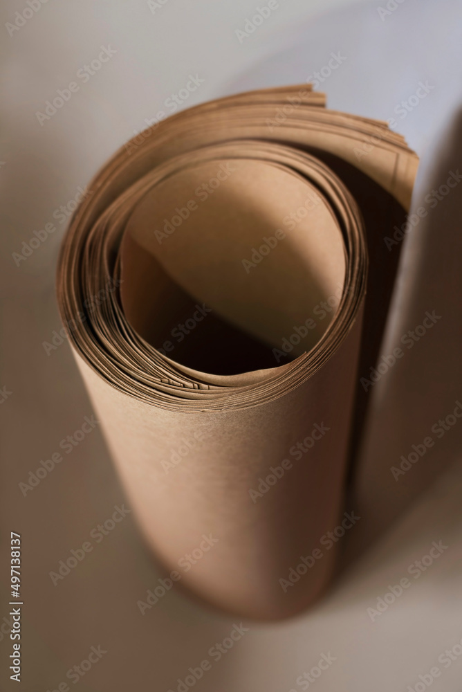 Twisted roll of kraft paper, top view, close up. Kraft paper for ...