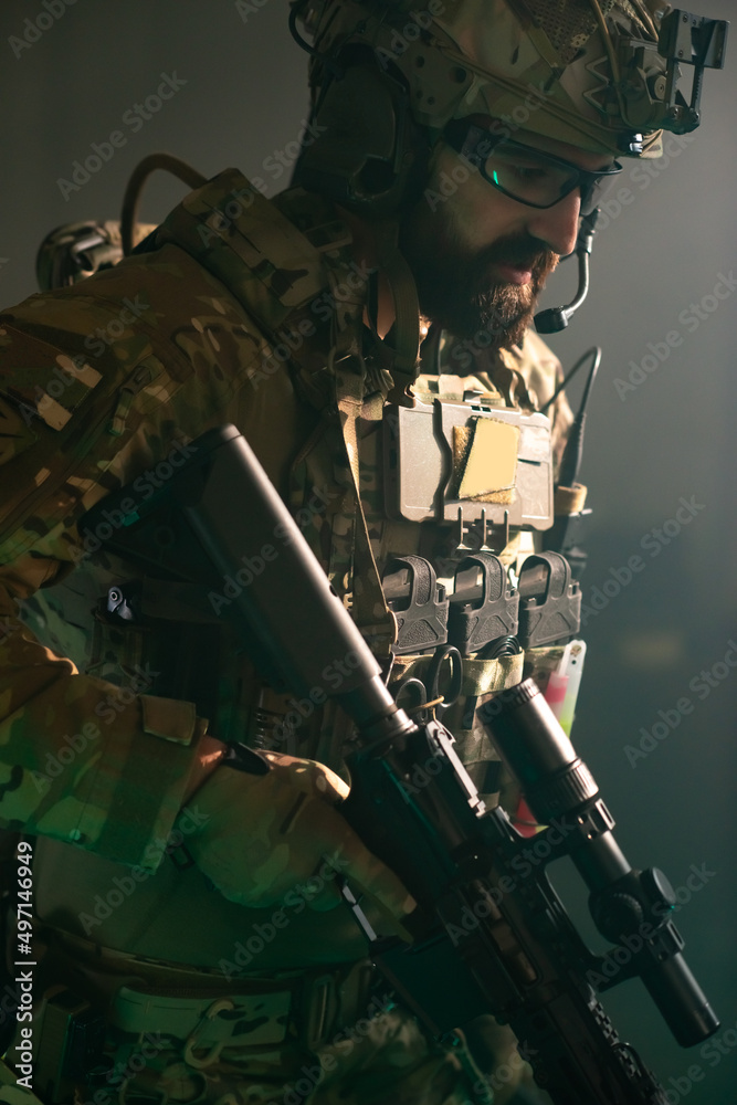 Side view of good-looking bearded man in military equipment. Man in ...