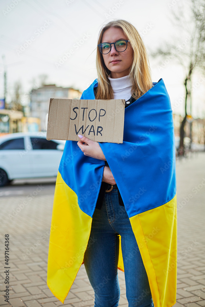 Portrait Of A Joyful Ukrainian Woman Holding A Ukrainian Flag And A Portrait Of A Joyful Ukrainian Woman Holding A Ukrainian Flag And A