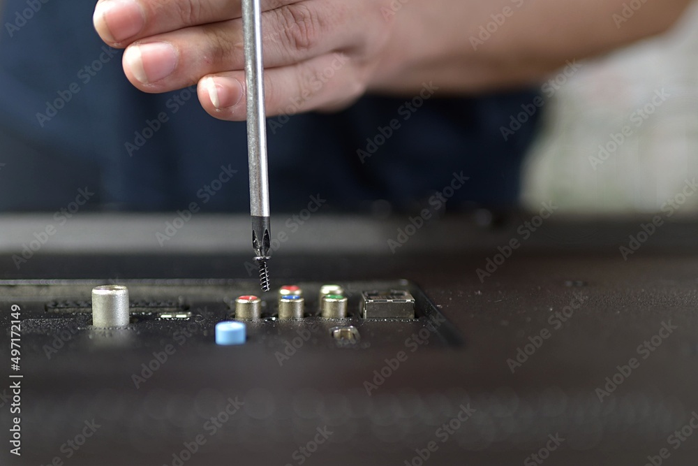 Rear TV panel with input and output connectors.detail of the screw when ...