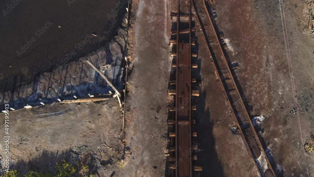 Railroad at the salt deposit. Extraction of sedimentary salt from sea ...