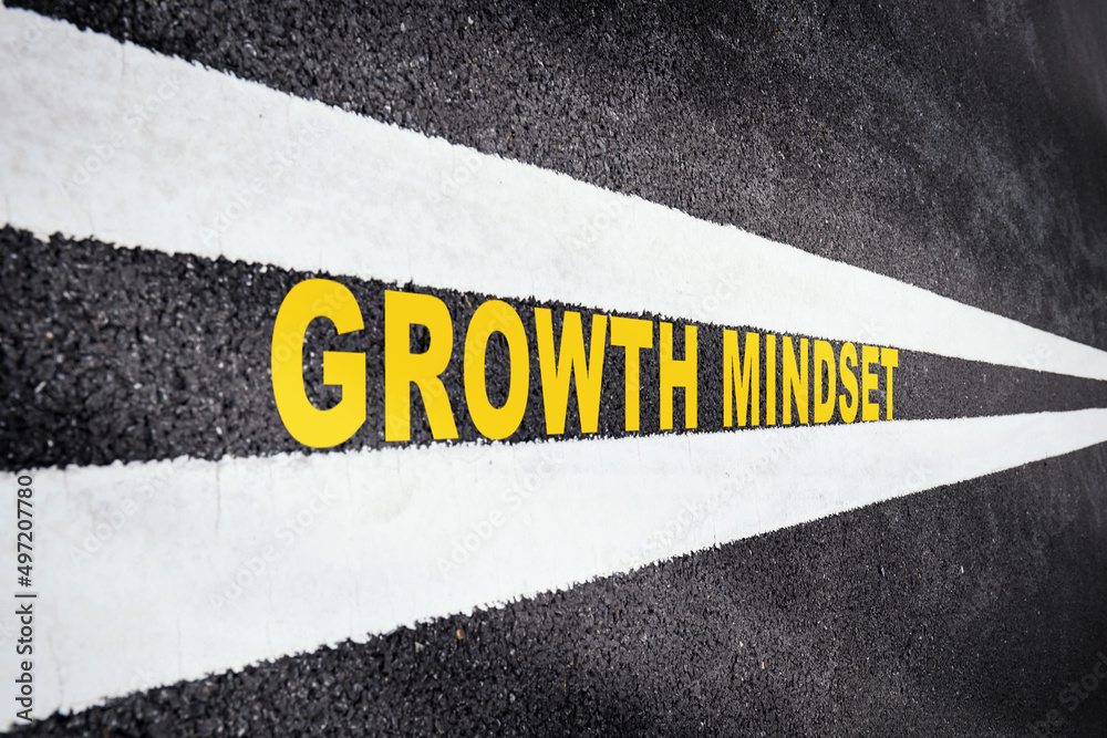 Growth mindset on asphalt road with marking lines for giving directions ...