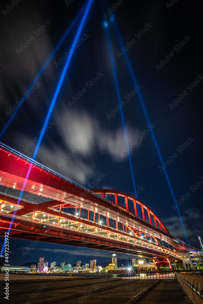Vertical shot of the famous historic Kobe Bridge at night with city ...