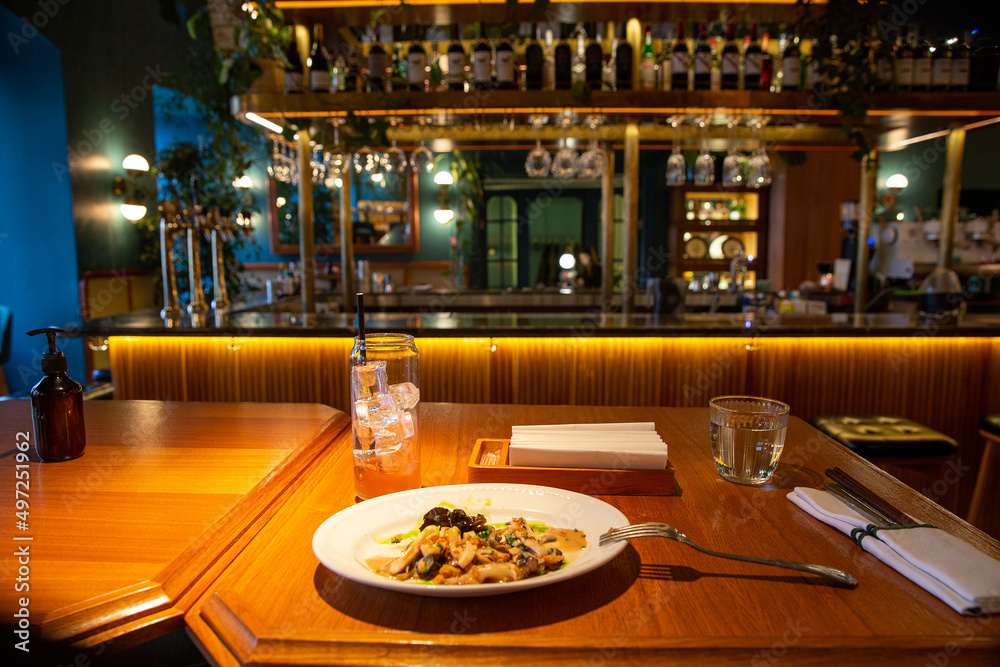 Interior of modern loft style restaurant. Bar counter. Interior porch ...