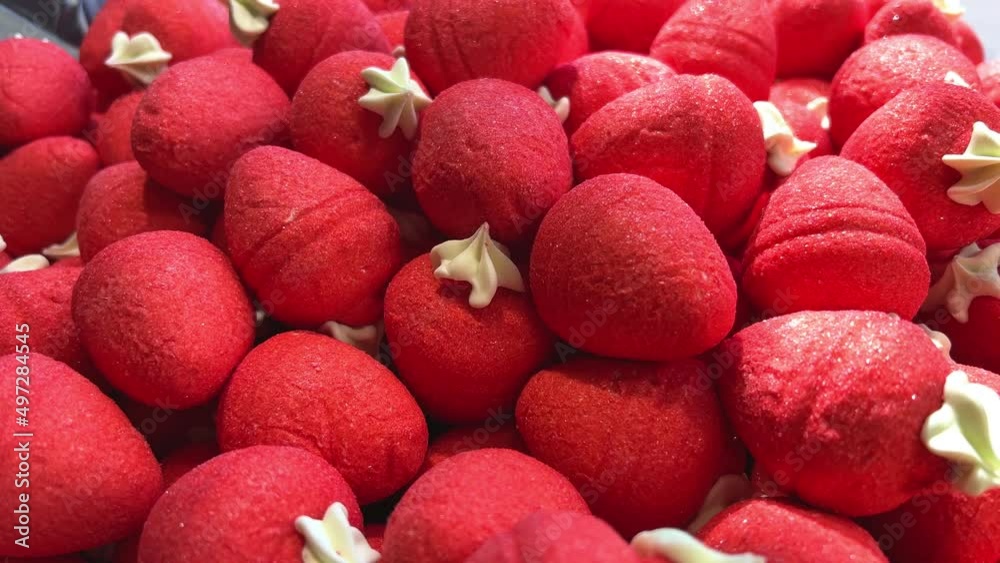 strawberry jelly sweets on the counter are laid out all the colors of ...