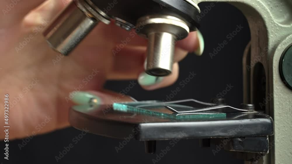 Microscope glass and magnifying glass rise close up. The study of the ...