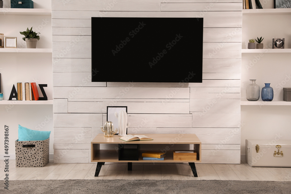 Cozy room interior with stylish decor and modern TV set Stock Photo ...