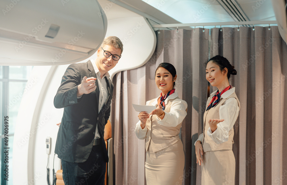 Flight attendant woman or Air hostess in uniform checking seats ...